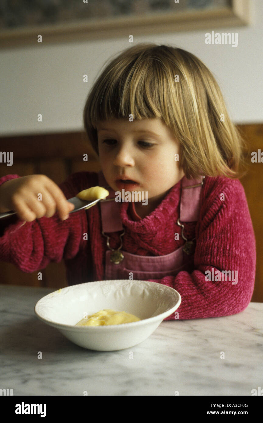 child eating custard Stock Photo - Alamy