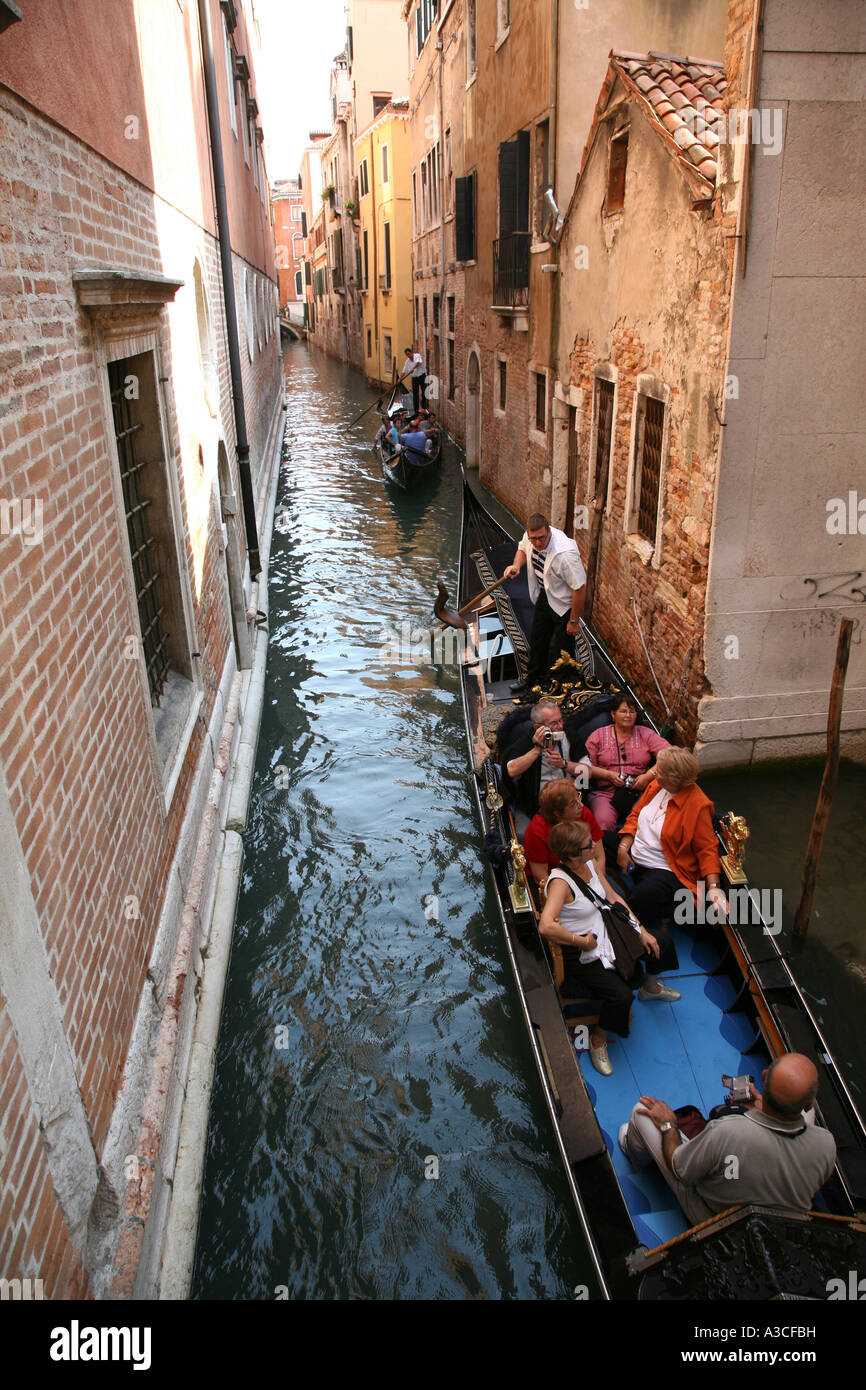High overhead view of a gondola with tourist on the grand canal in ...