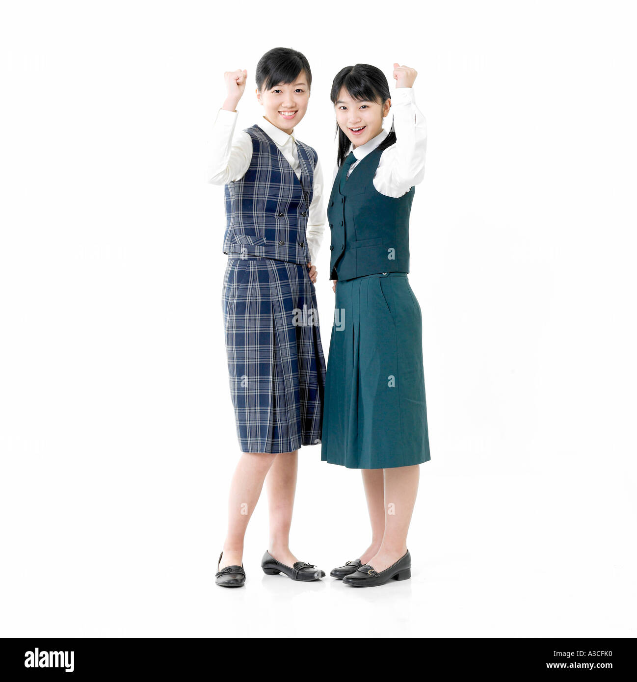 Teen girls making cheering pose Stock Photo - Alamy