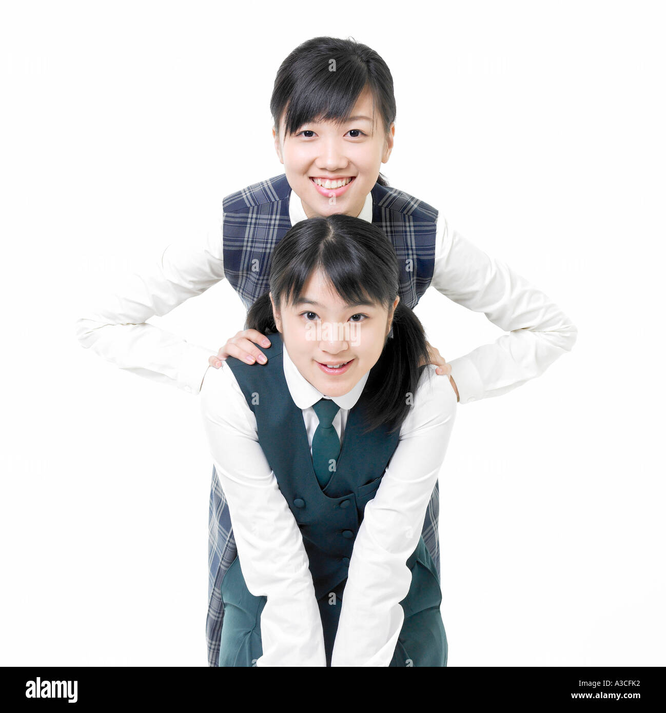 Teen girls putting her arm on her friend's shoulder Stock Photo - Alamy