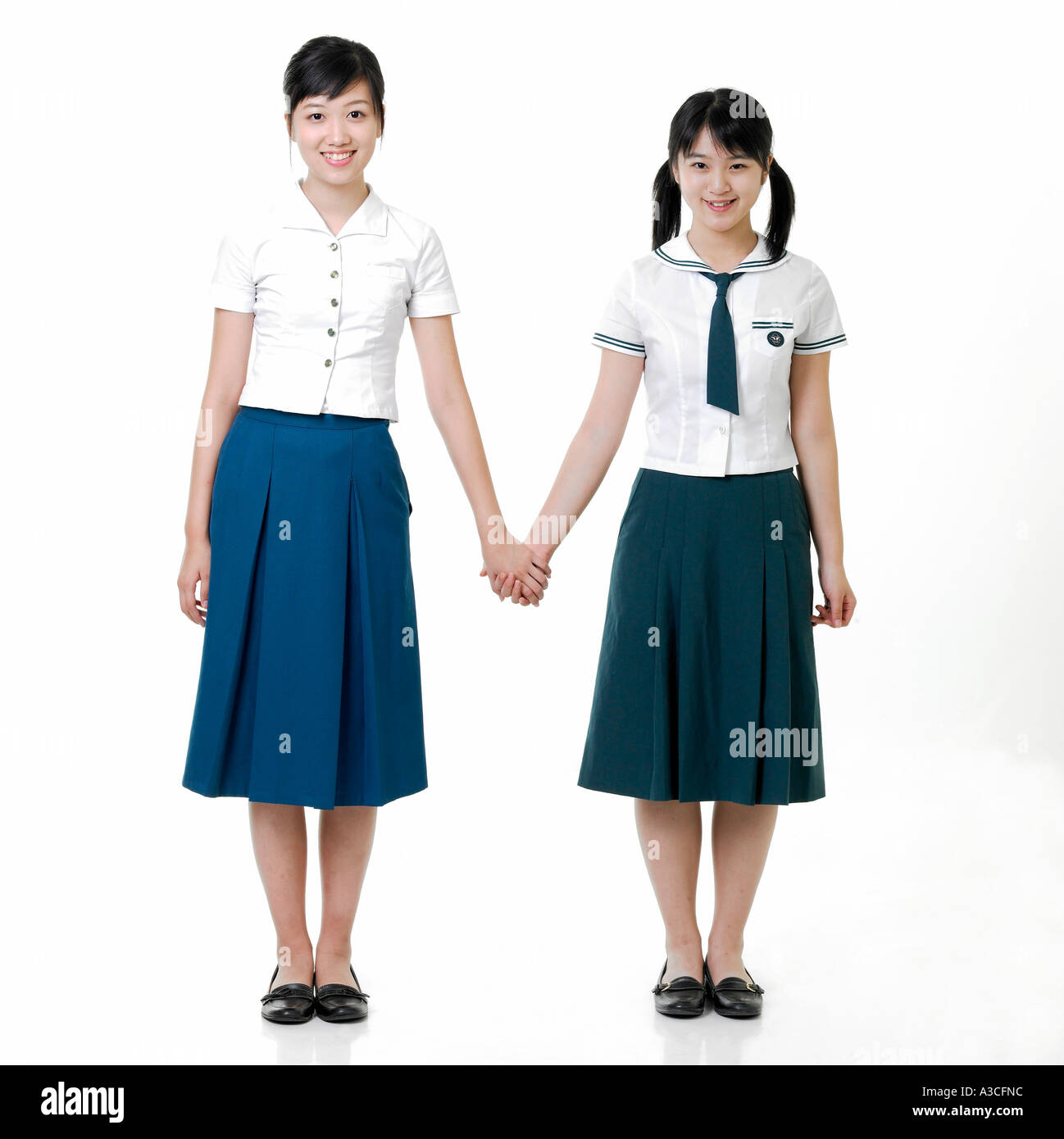 Teens holding hands each other Stock Photo - Alamy