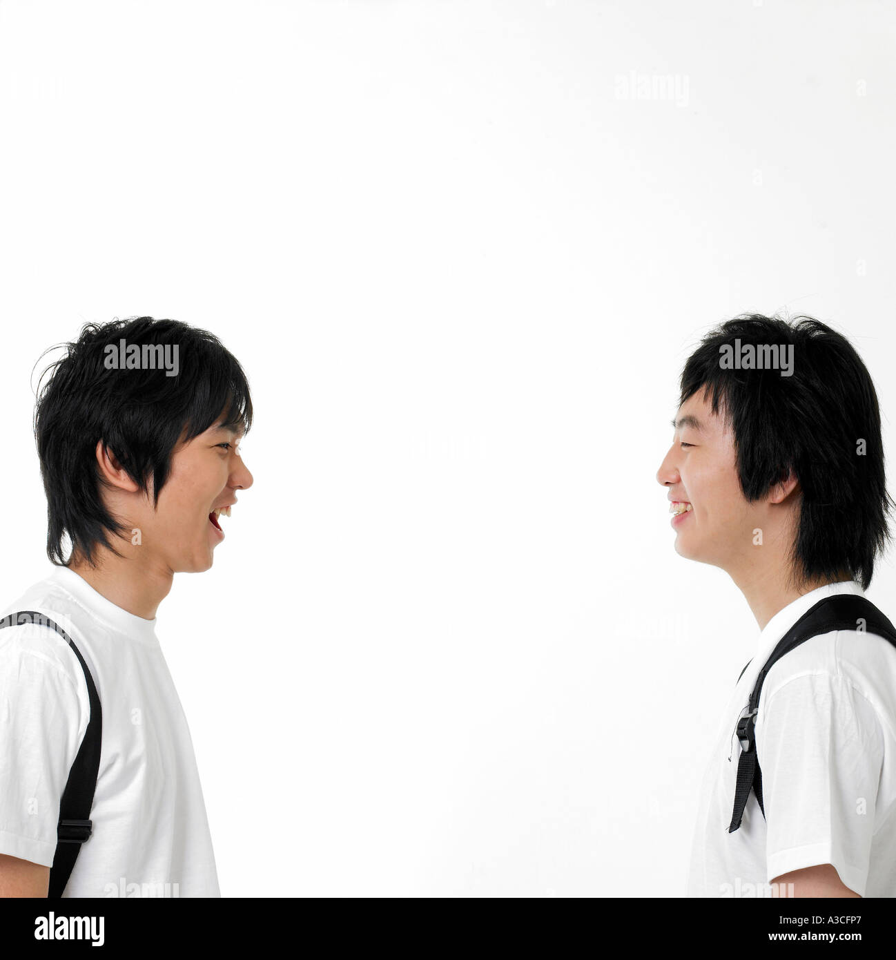 Two boys are staring at each other, smiling Stock Photo - Alamy
