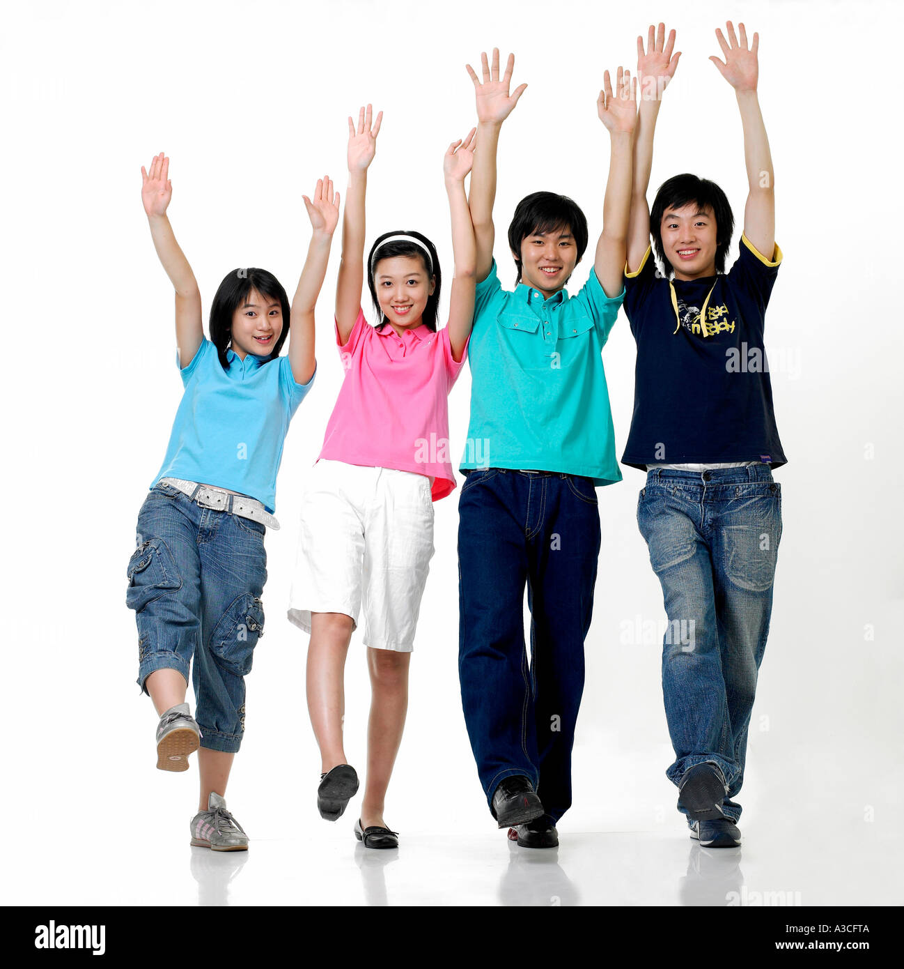 Four students are putting their hands up Stock Photo - Alamy