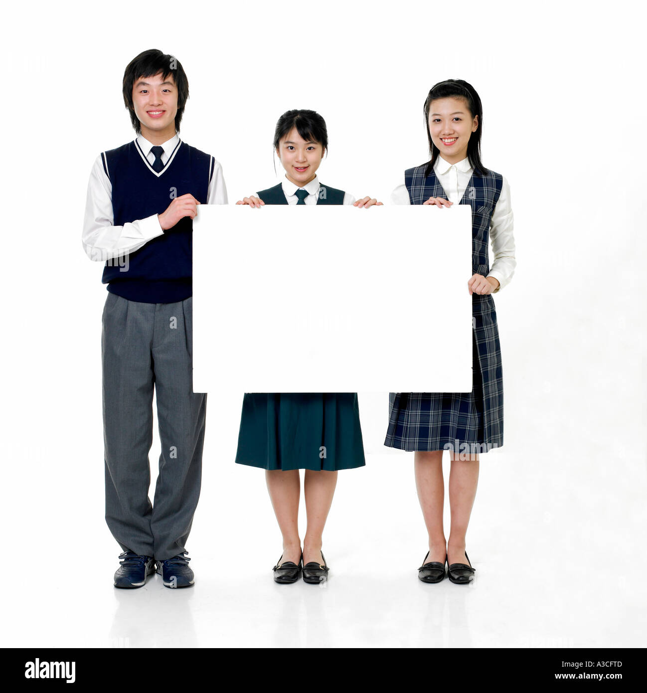 Three students are holdng white paper Stock Photo - Alamy
