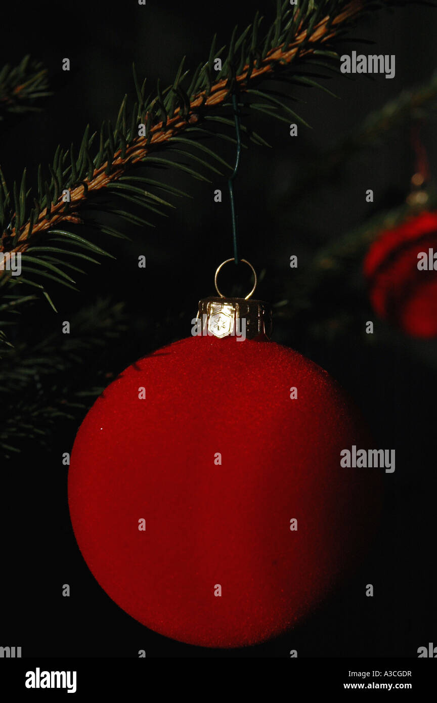 Red bauble on Christmas tree Stock Photo - Alamy