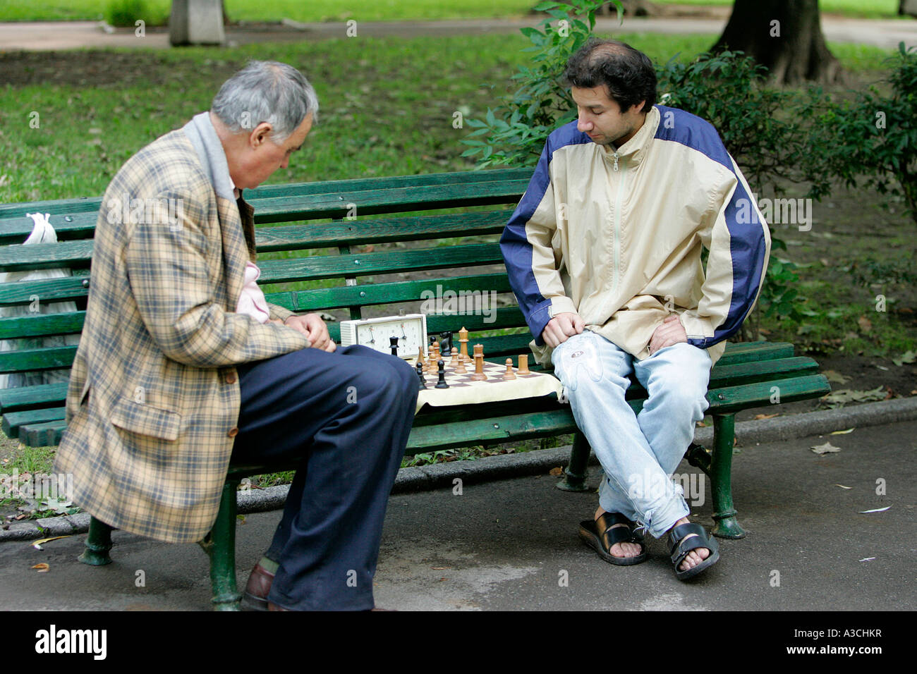 Two Chess player put their table on the bench Stock Photo - Alamy