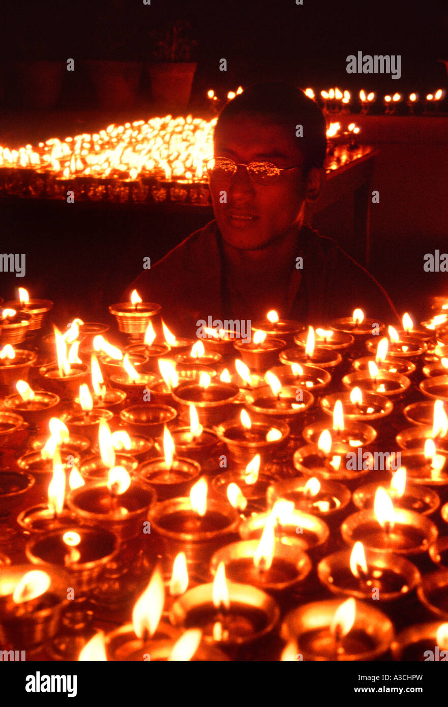 Tibetan Buddhist monk praying in a monastery in Nepal Stock Photo - Alamy