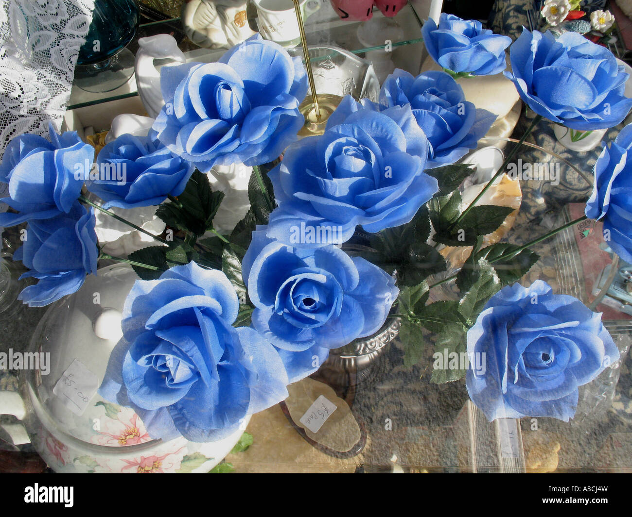 blue paper flowers charity shop window Cornwall UK Stock Photo - Alamy