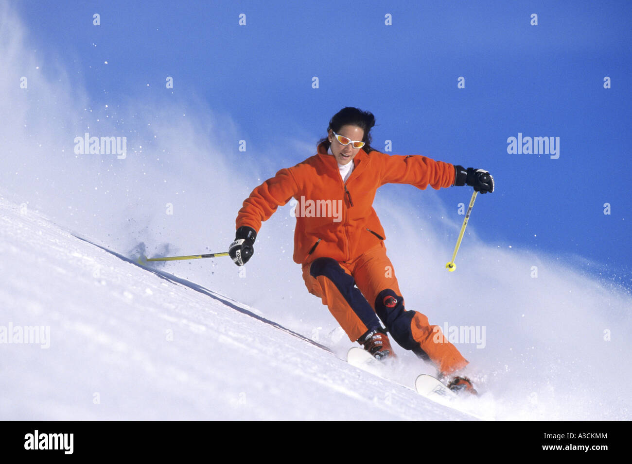 female skier racing downhill, Austria, Alps Stock Photo - Alamy