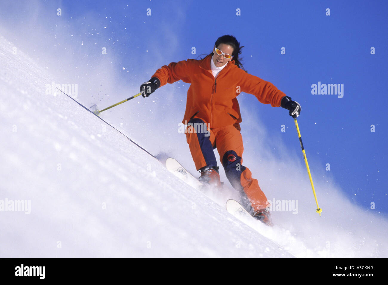 female skier racing downhill, Austria, Alps Stock Photo - Alamy