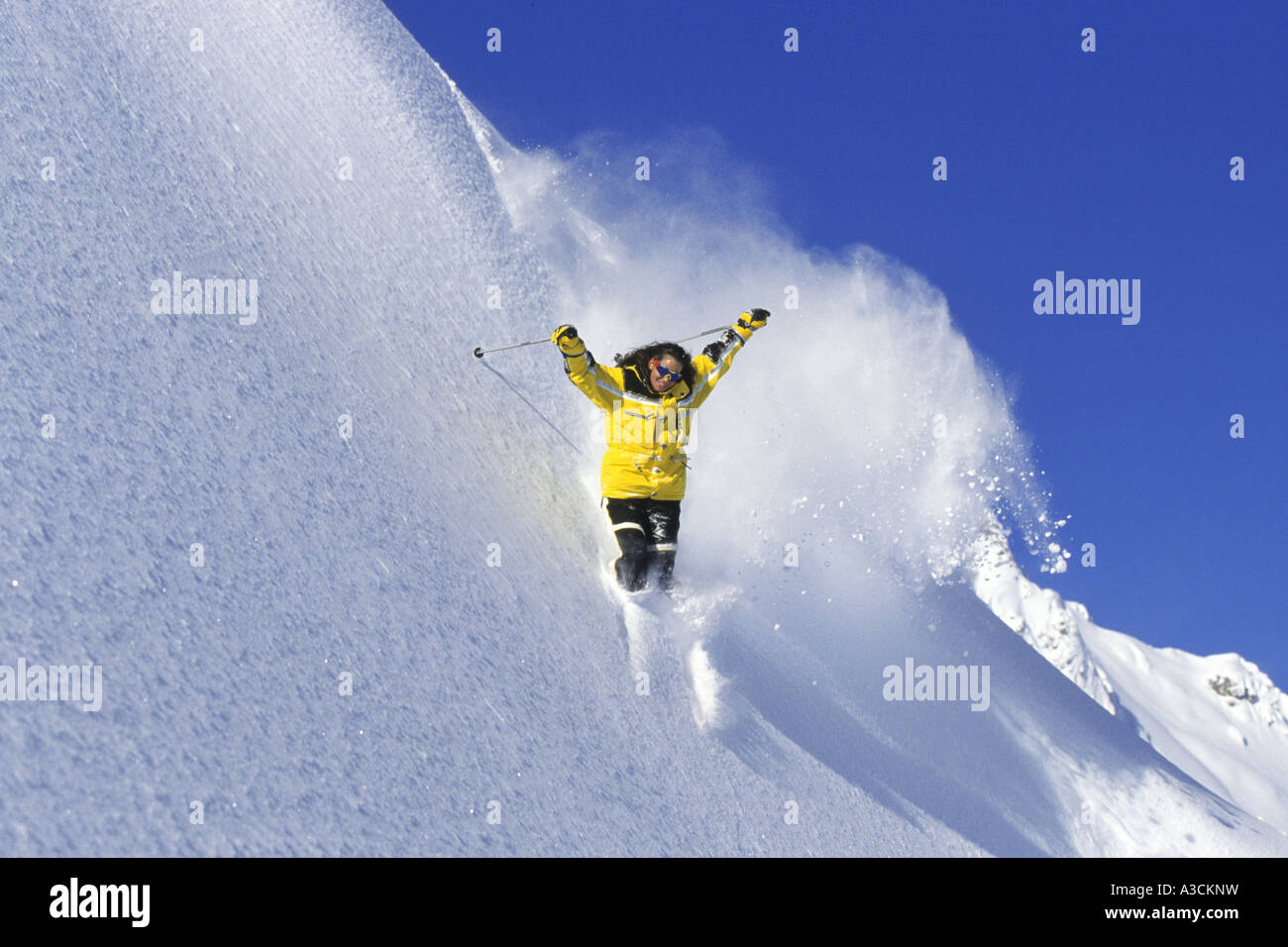 female skier racing downhill, Austria, Alps Stock Photo - Alamy
