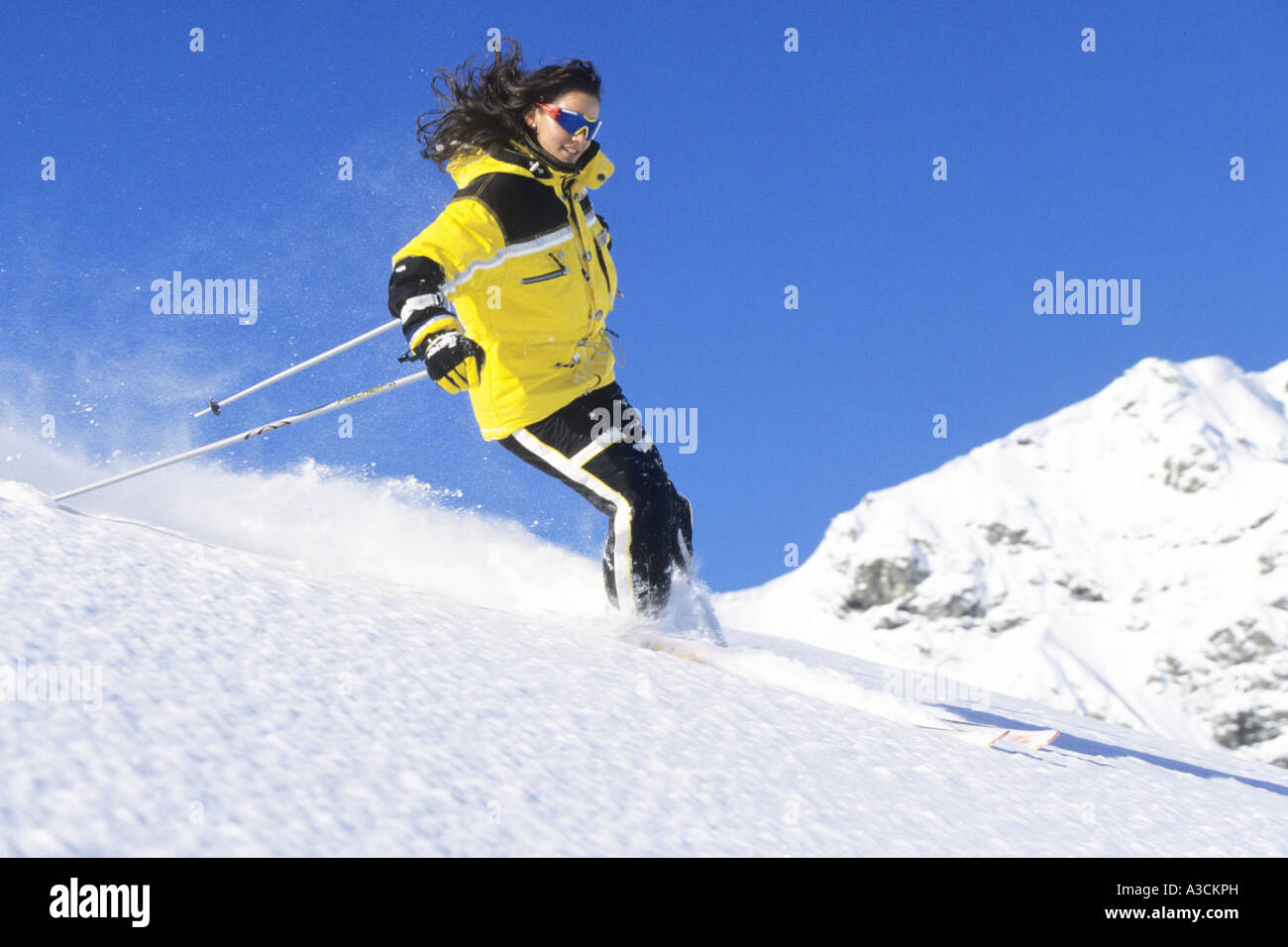 female skier racing downhill, Austria, Alps Stock Photo - Alamy