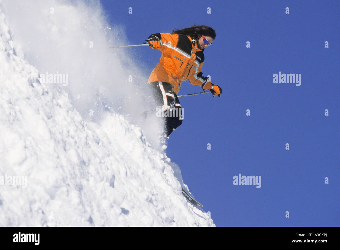 female skier racing downhill, Austria, Alps Stock Photo - Alamy
