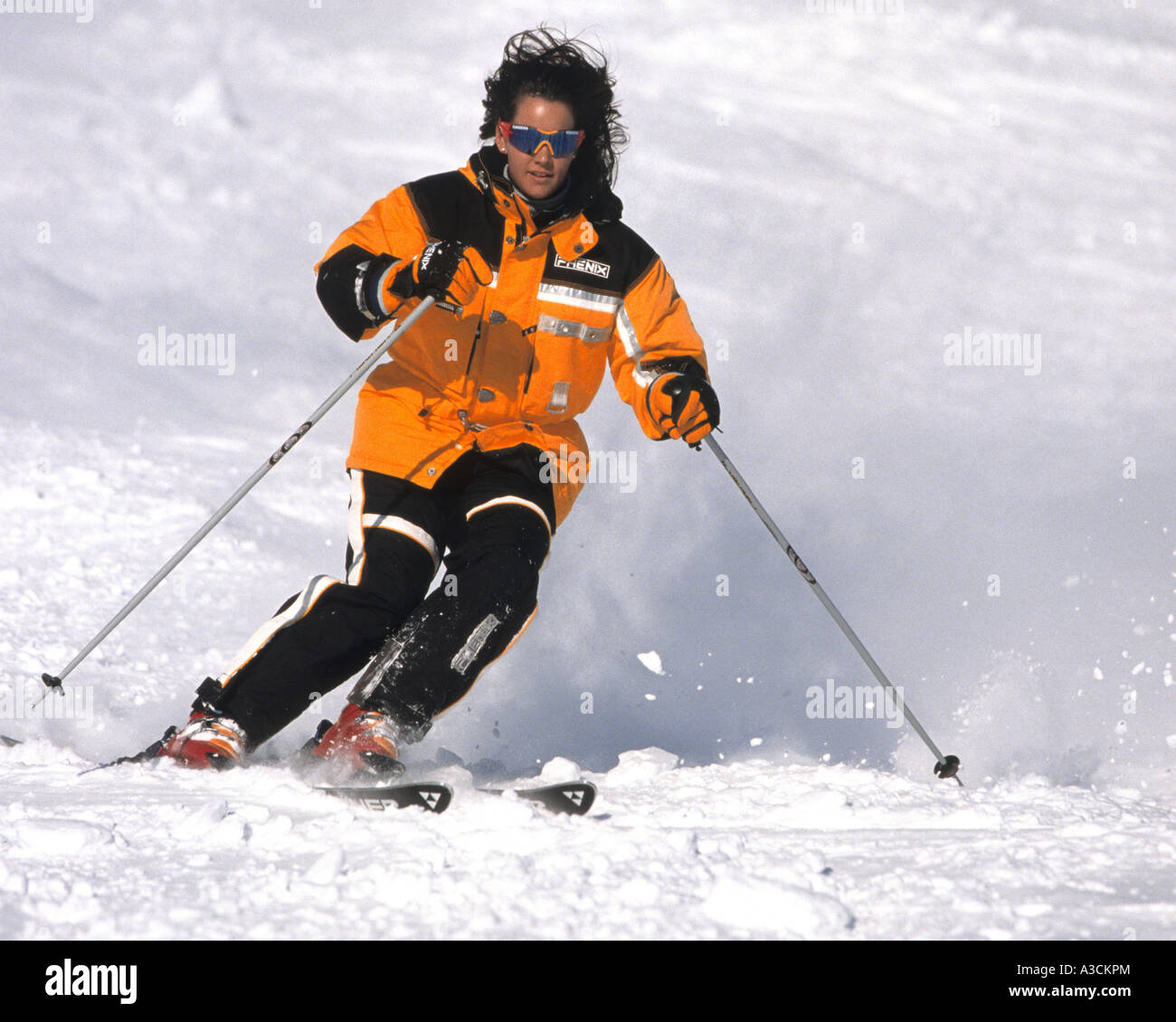 female skier racing downhill, Austria, Alps Stock Photo - Alamy