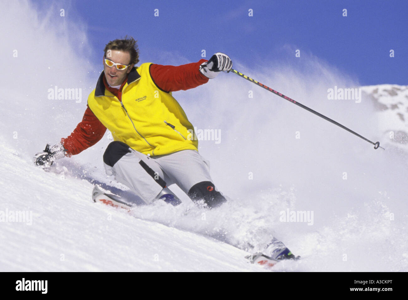 skier racing downhill, Austria, Alps Stock Photo - Alamy