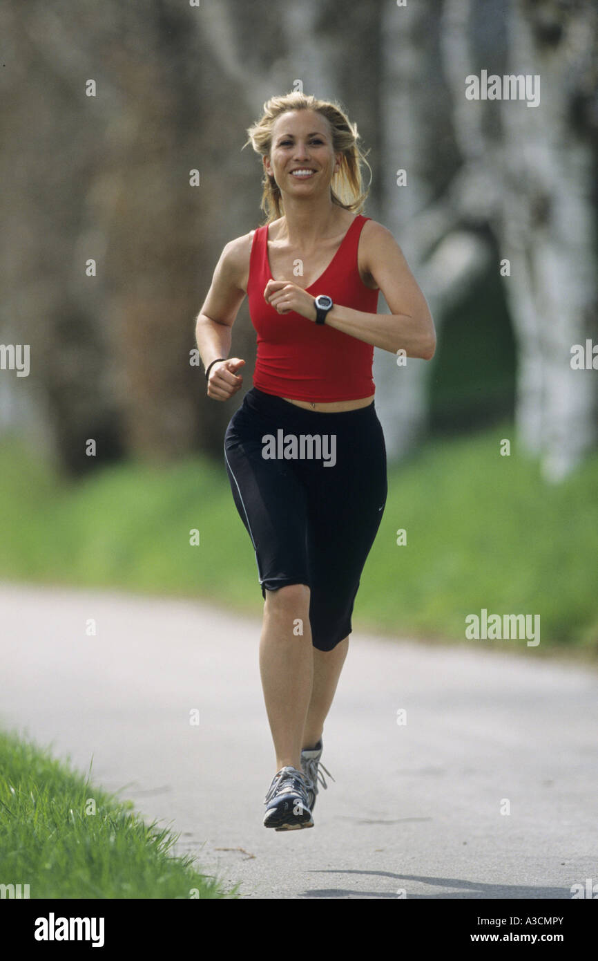 a jogging woman Stock Photo - Alamy
