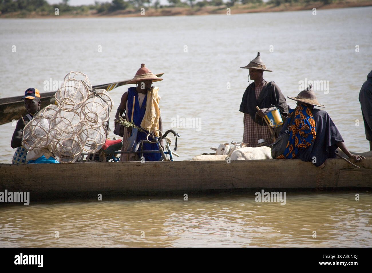 People on the way across the Bani river on route to the Monday market ...