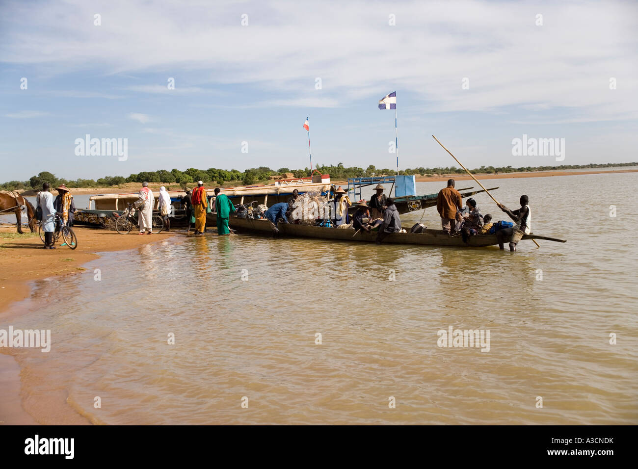 People on the way across the Bani river on route to the Monday market ...