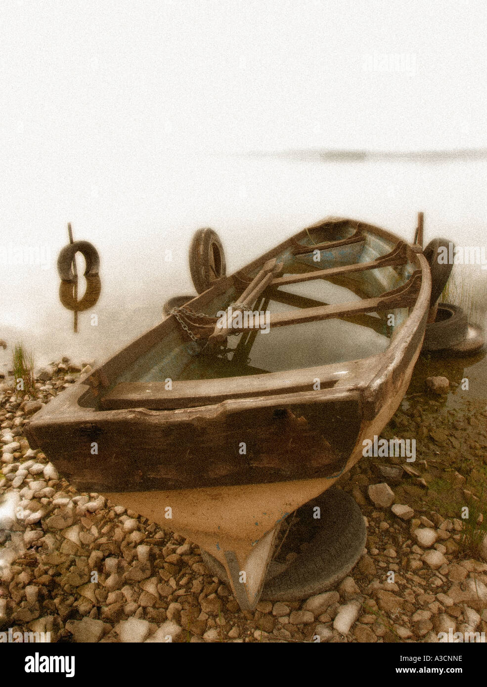 Water filled boat on a lake Stock Photo - Alamy