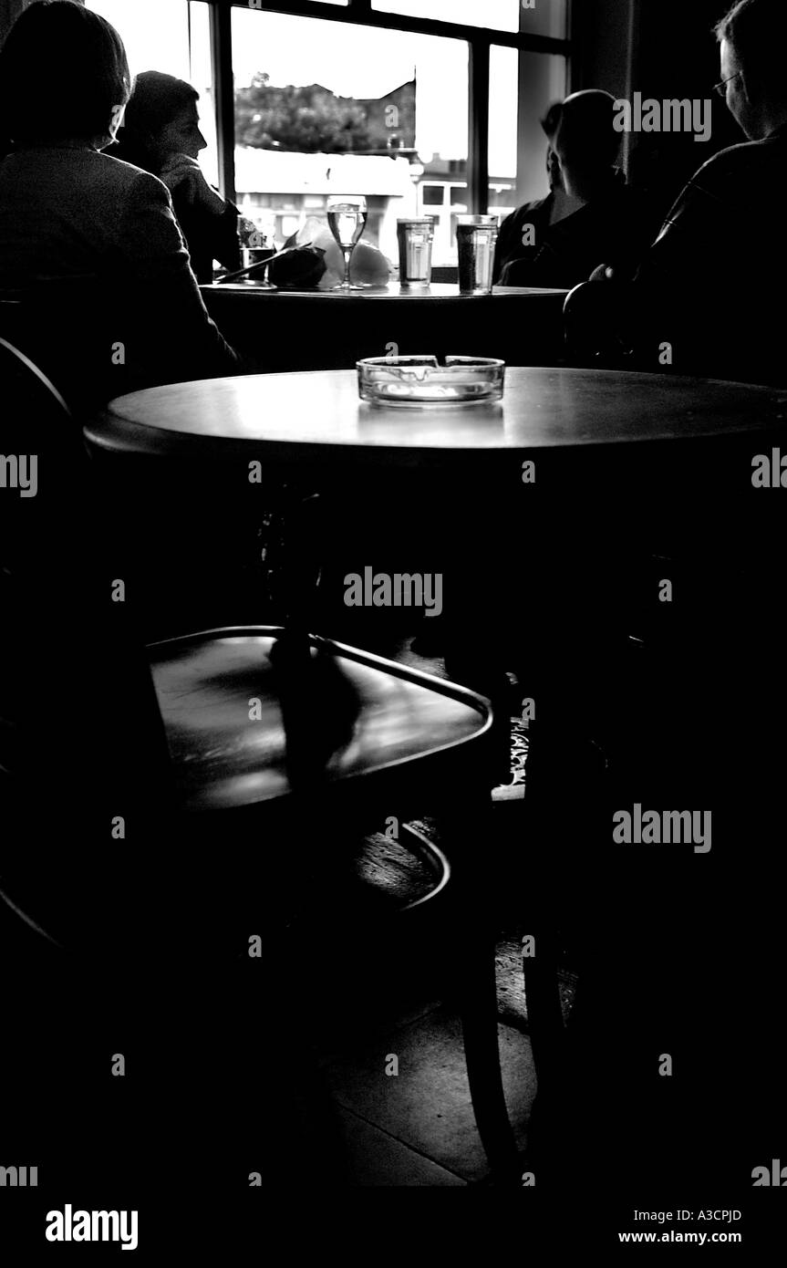 Patrons relax in The Falcon Pub Clapham North London United Kingdom ...