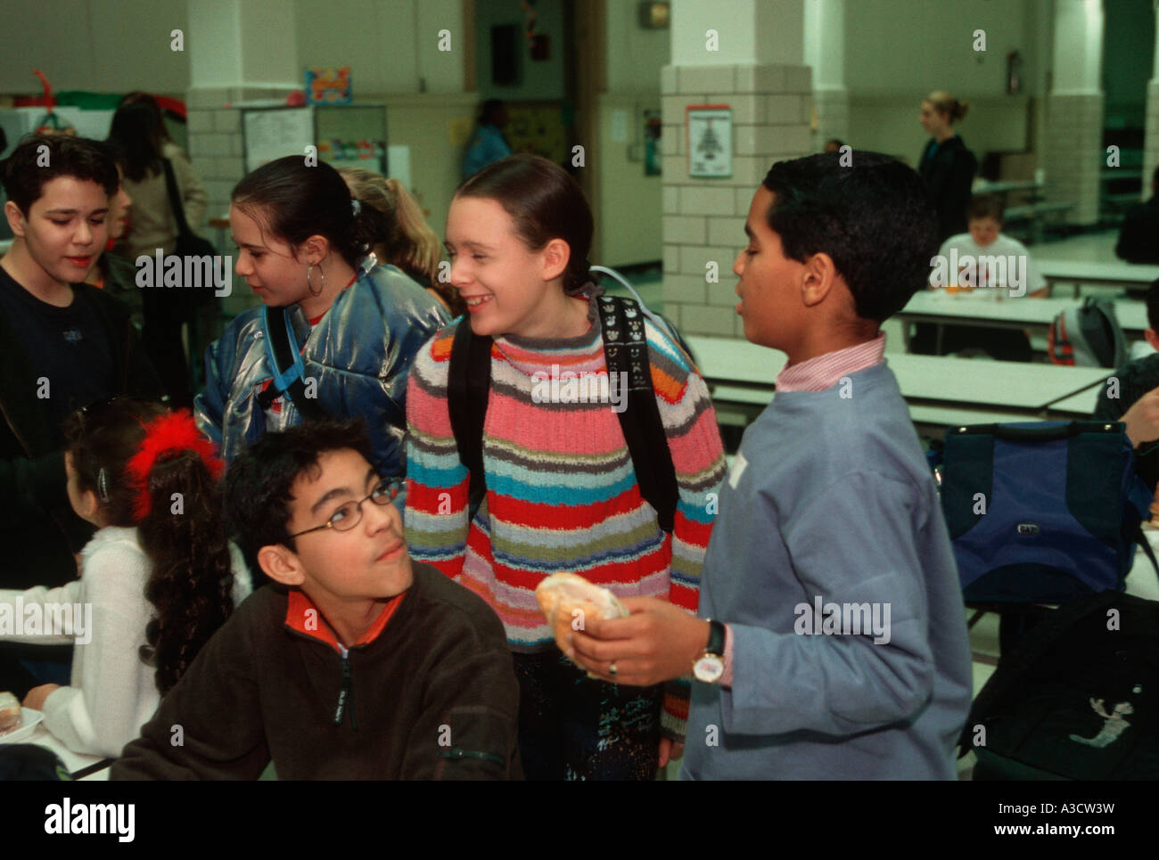 Junior high school students conversing in the lunchroom at a Manhattan ...