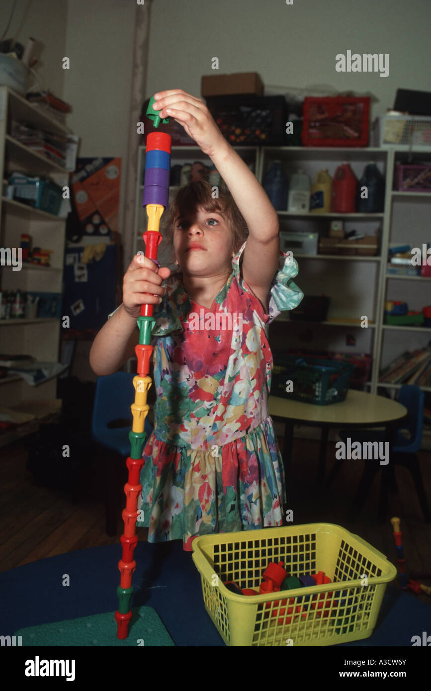 Young children love to build tall towers Stock Photo - Alamy
