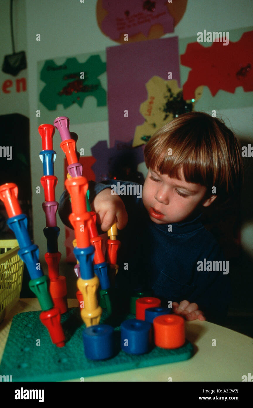 Young children love to build tall towers Stock Photo - Alamy