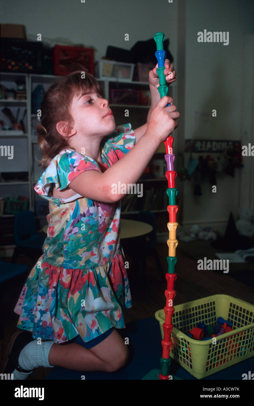 Young children love to build tall towers Stock Photo - Alamy