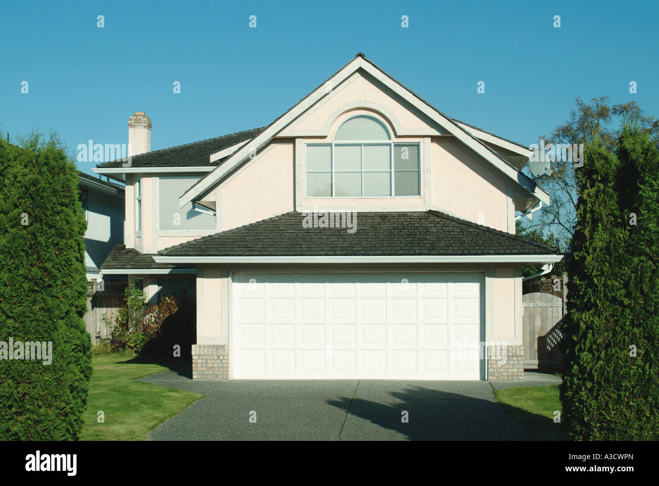 Suburban house and garage Stock Photo - Alamy