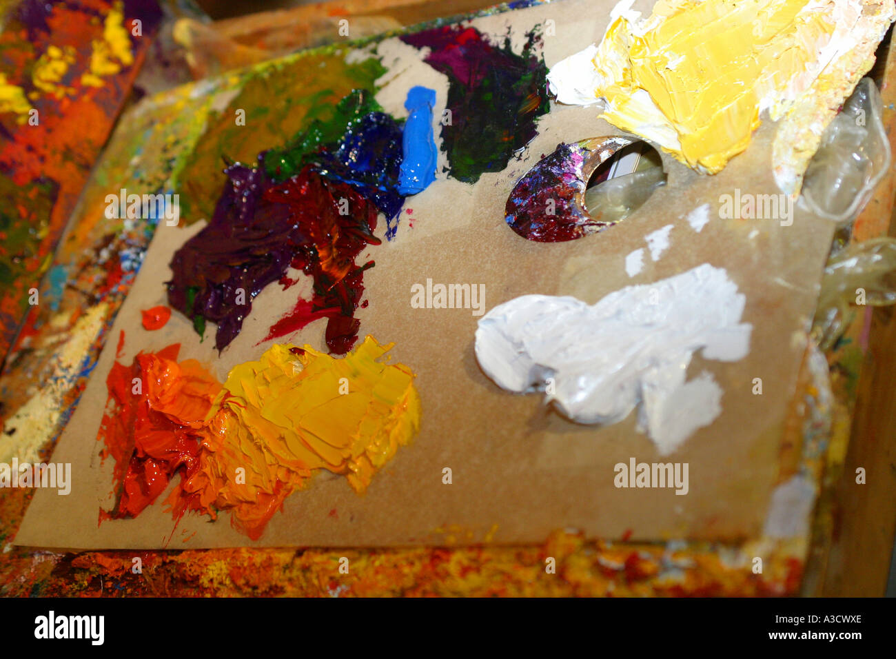 Artist at work doing an oil painting Stock Photo - Alamy