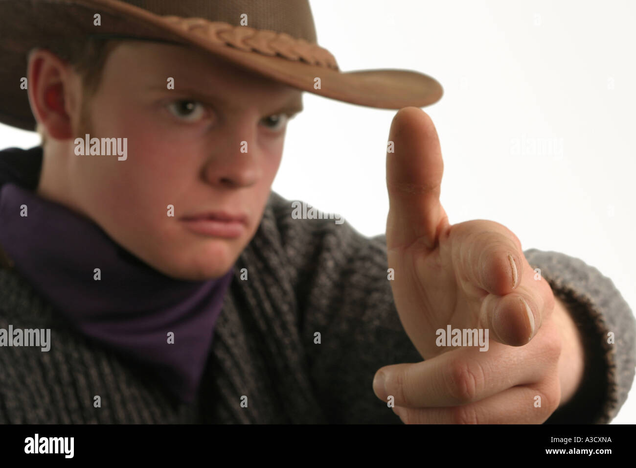Male teenage cowboy pointing imaginary hi-res stock photography and ...
