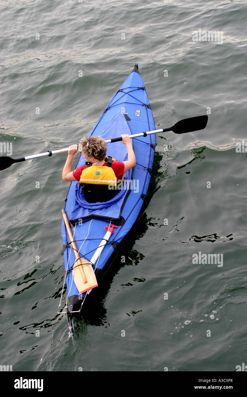 KAYAKING on a calm sea Stock Photo - Alamy