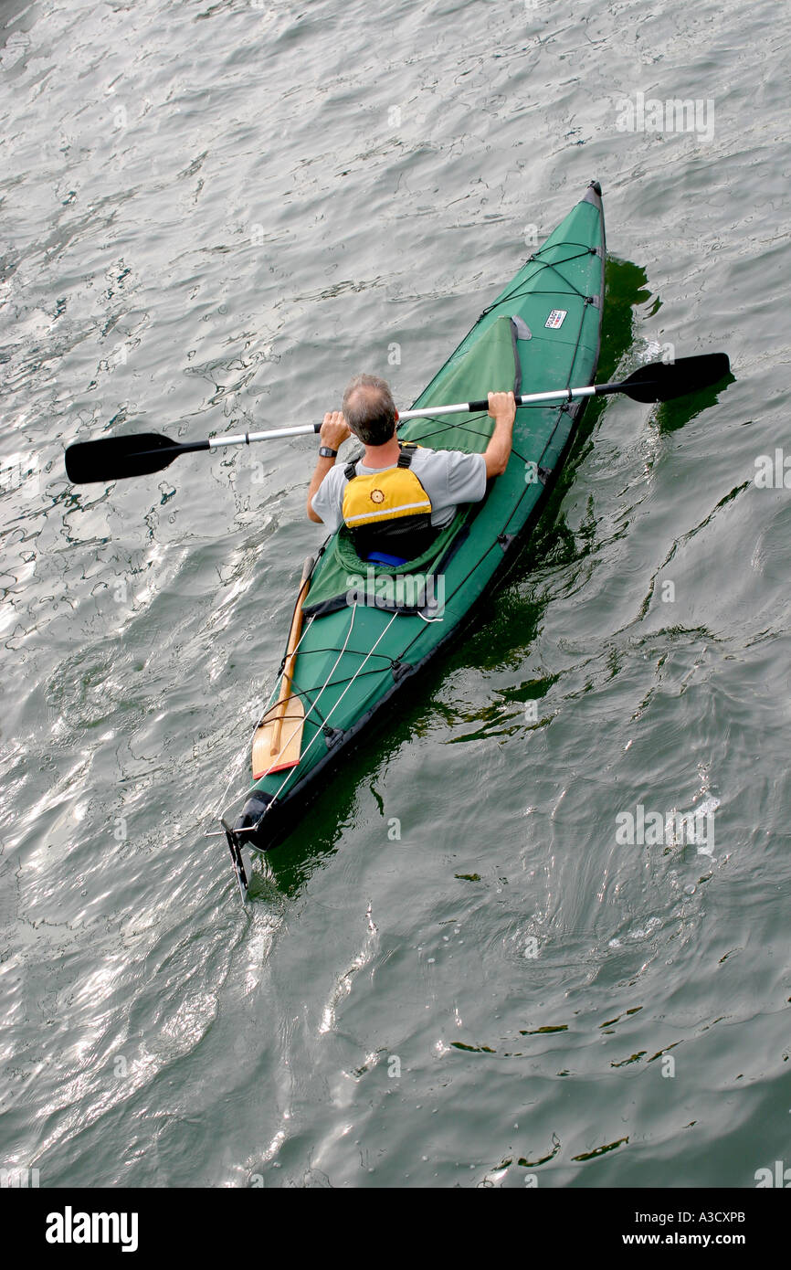 KAYAKING on a calm sea Stock Photo - Alamy