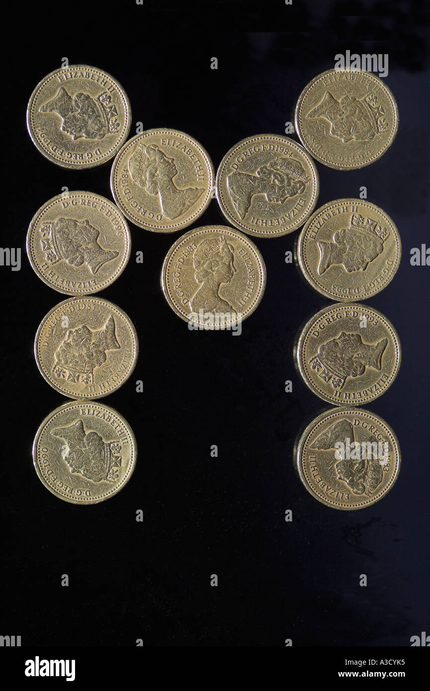 BRITISH POUND COIN FONT LETTER M ON BLACK Stock Photo - Alamy