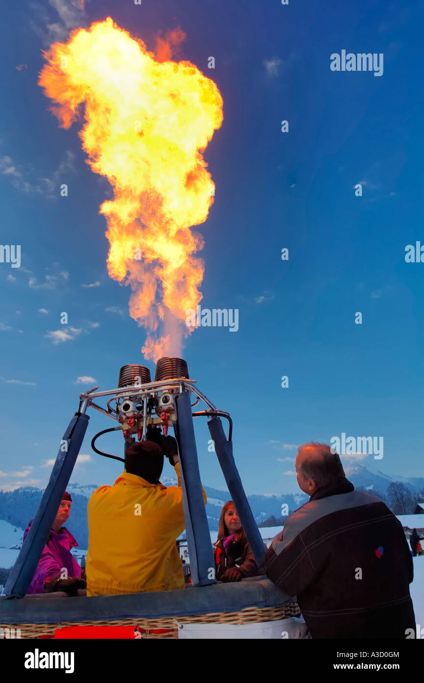 Testing the burner of a hot air balloon at the Chateau d'Oex balloon ...