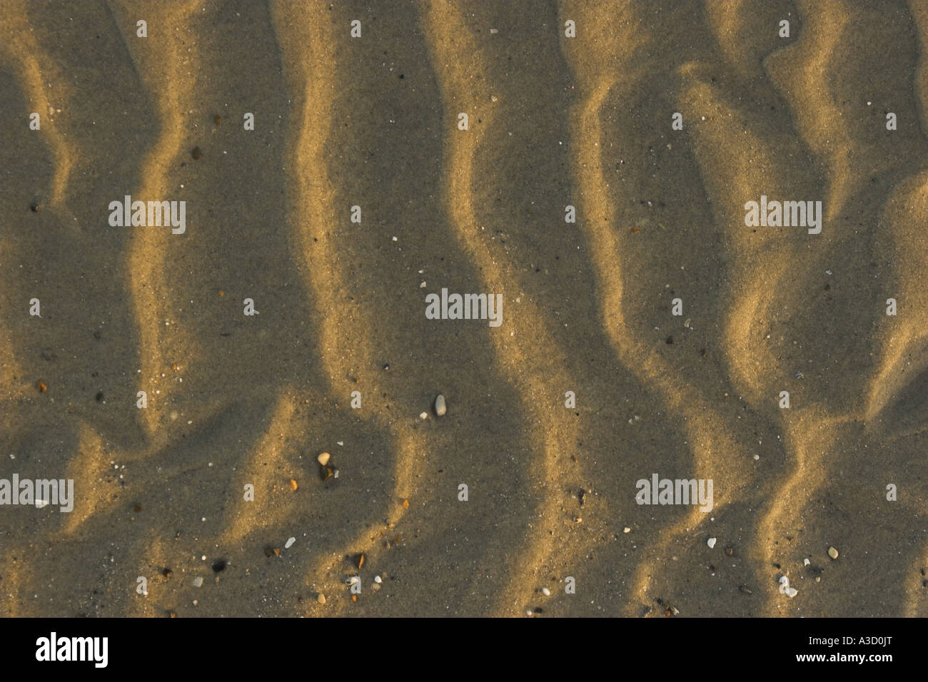 Concept / abstract - water patterns in sand Stock Photo - Alamy