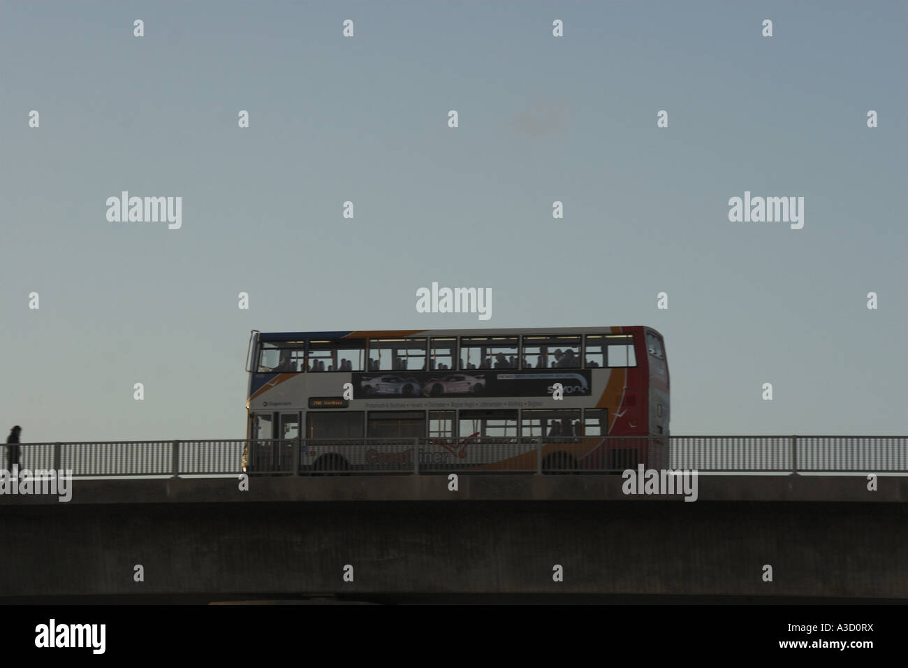 A bus passing over a bridge Stock Photo - Alamy