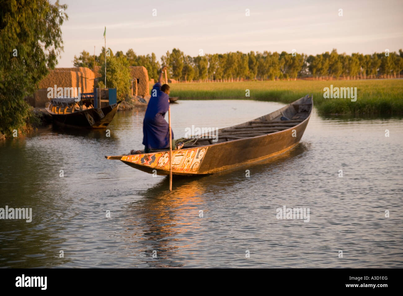 Pirogue wooden canoe crossing the Niger river at Korioume the port of ...