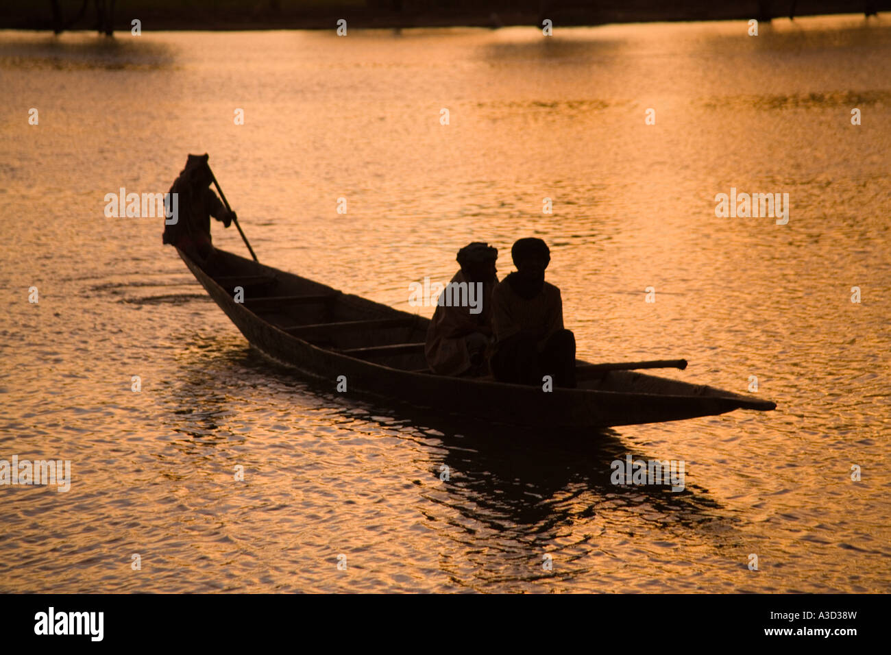 Pirogue wooden canoe crossing the Niger river at Korioume the port of ...