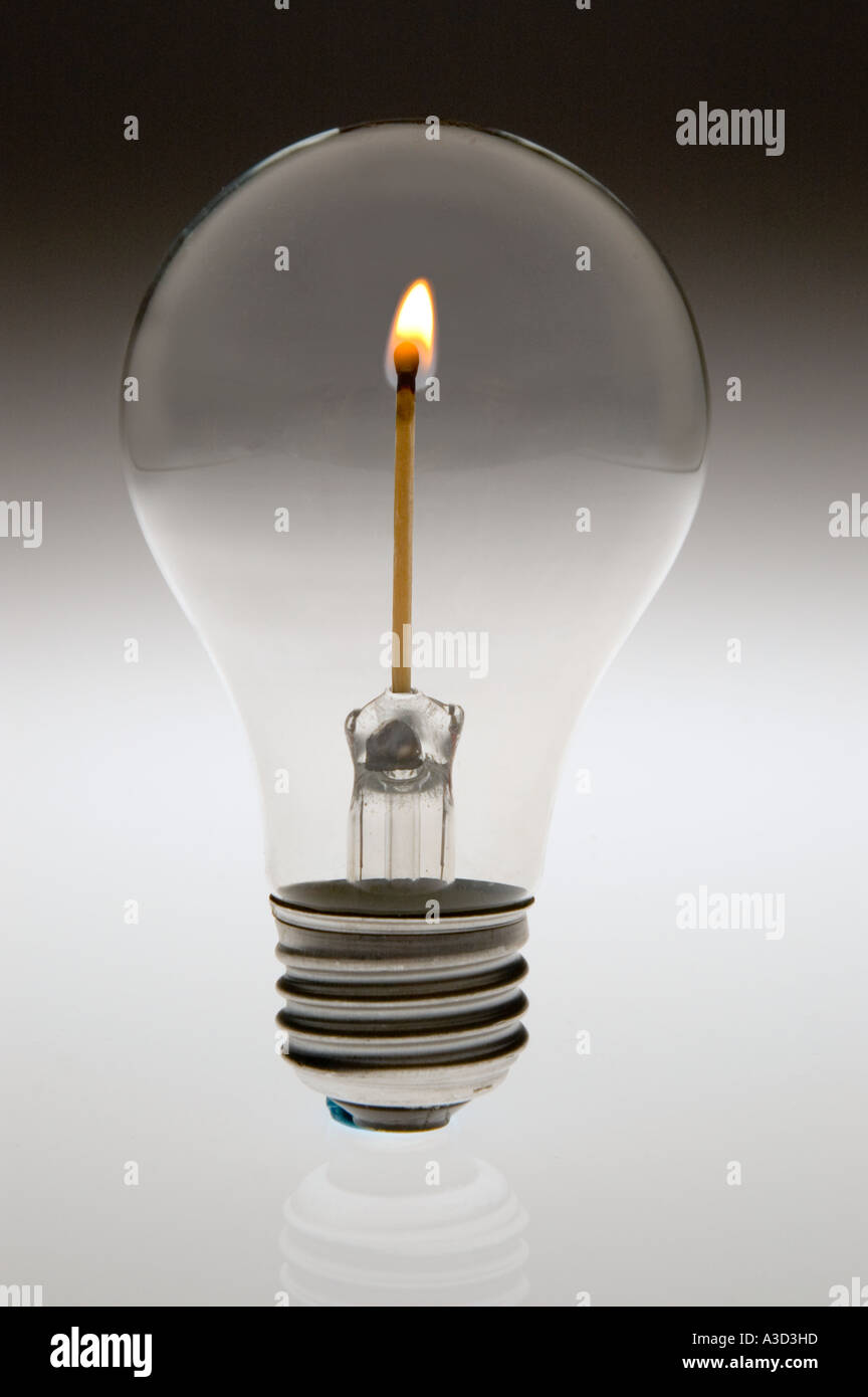 Clear light bulb with lit match inside Stock Photo - Alamy