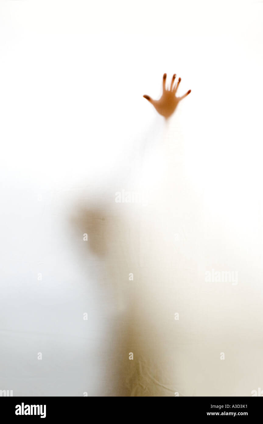 Hand trying to reach through a barrier Stock Photo - Alamy