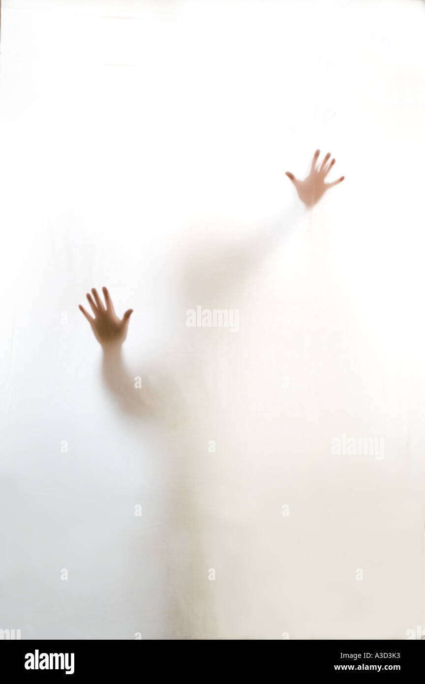 Hands trying to reach through a barrier Stock Photo - Alamy