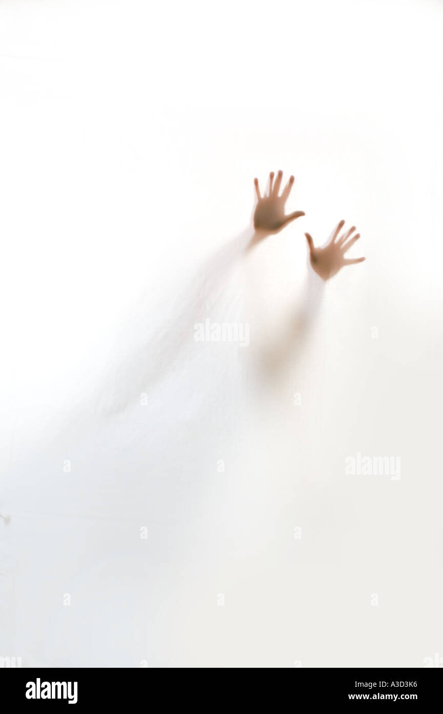 Hands trying to reach through a barrier Stock Photo - Alamy