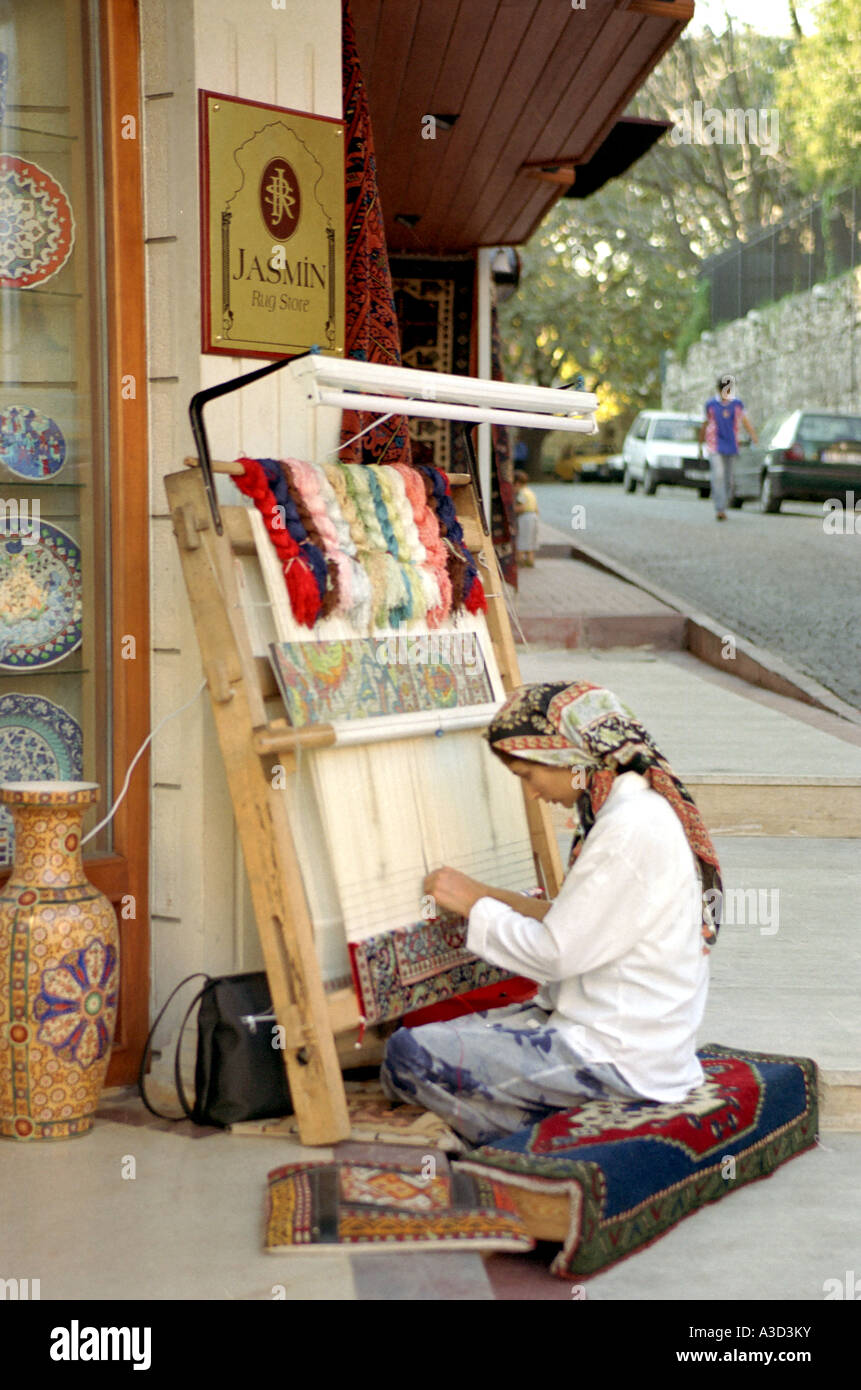Woman weaving carpet Istanbul Turkey Stock Photo - Alamy