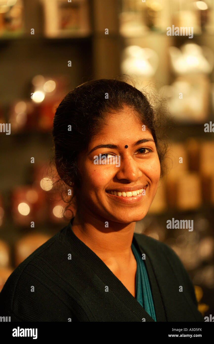 Close up portrait of smiling friendly Sri Lankan woman in shop at Tea ...
