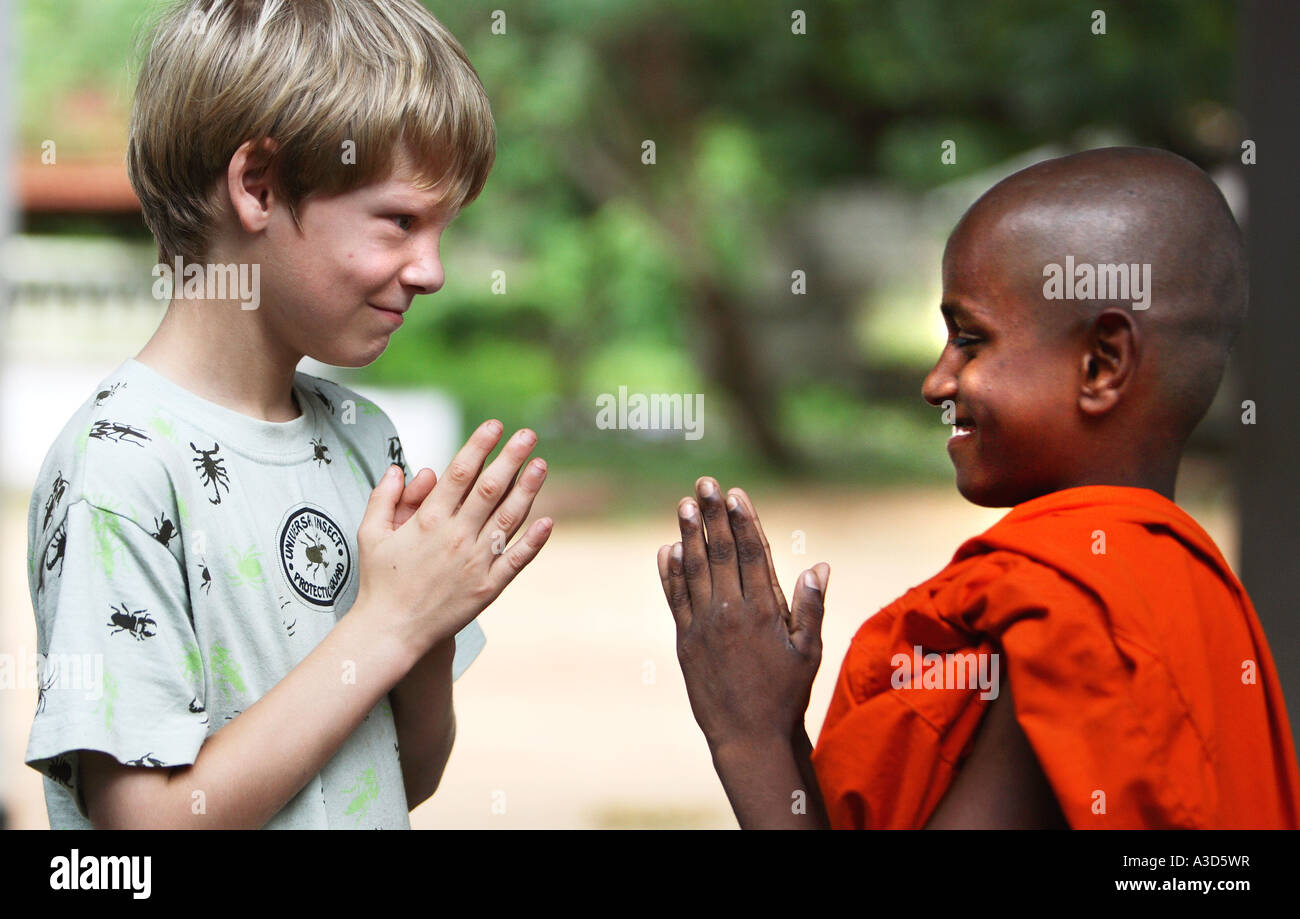 Close up portrait of young student Buddhist monk in traditional robes ...