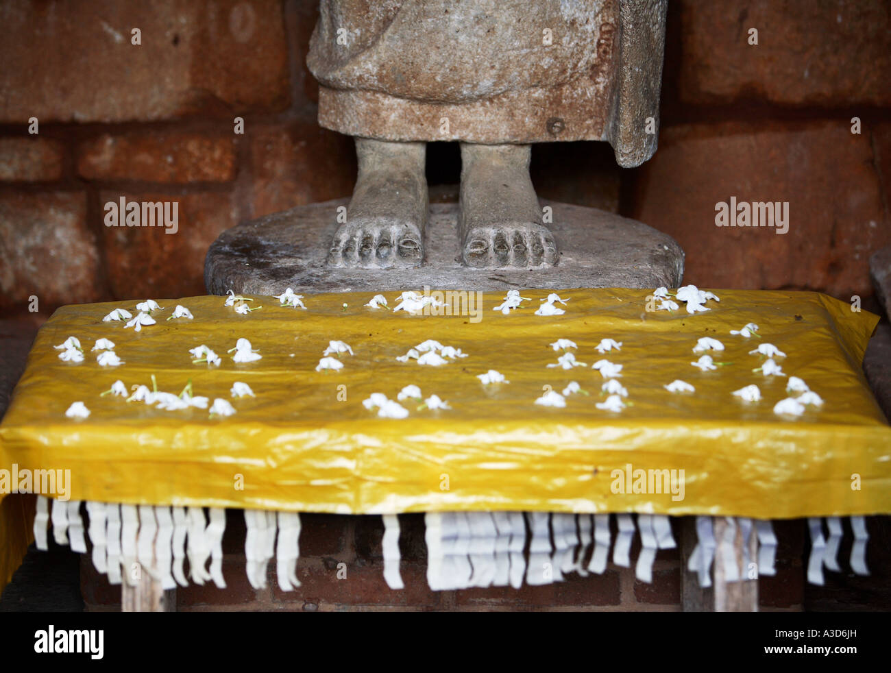 Indoor detail of offerings to deity in ancient stone Hindu temple near ...