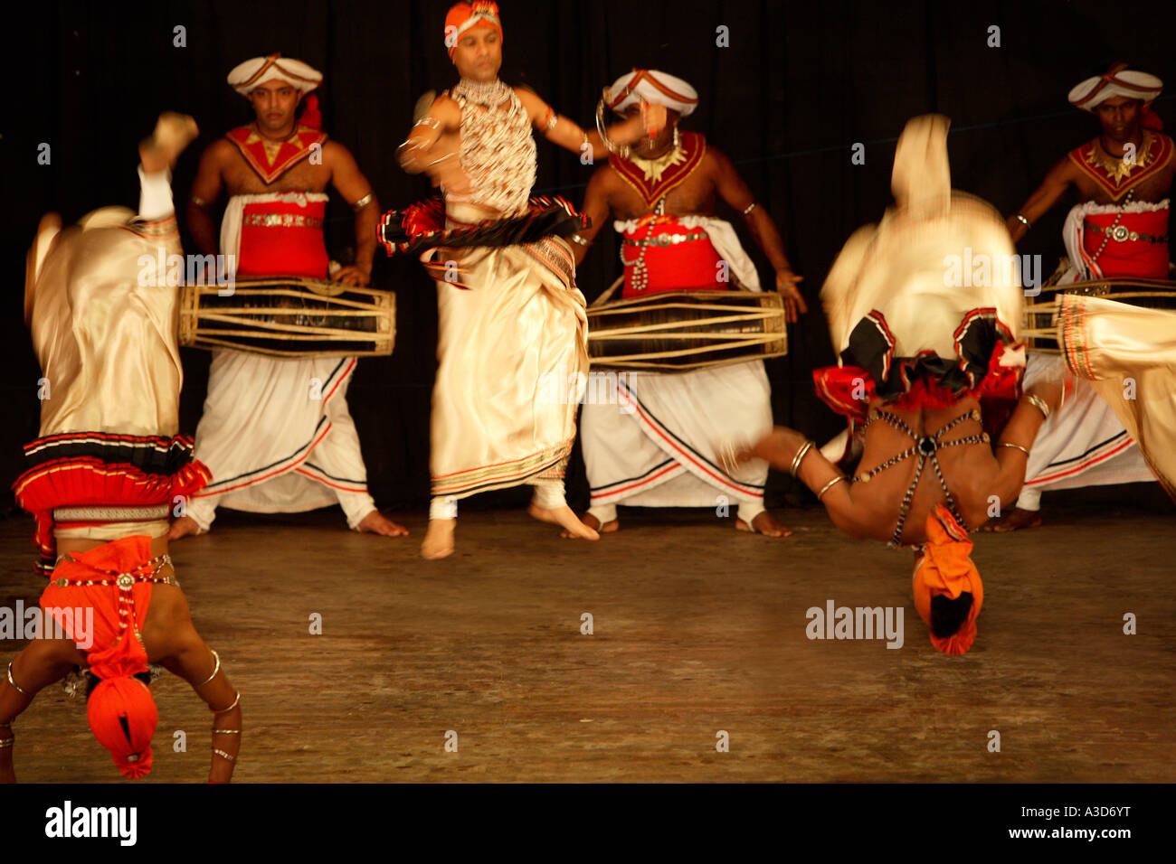 Portrait of world famous Kandy dancers in action performing on stage in ...