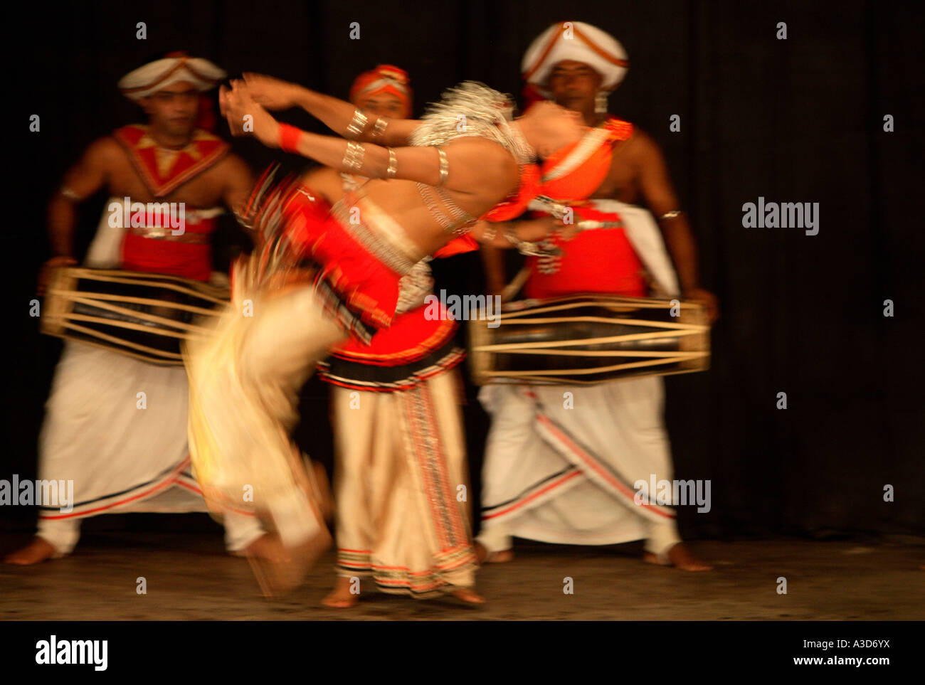 Portrait of world famous Kandy dancers in action performing on stage in ...