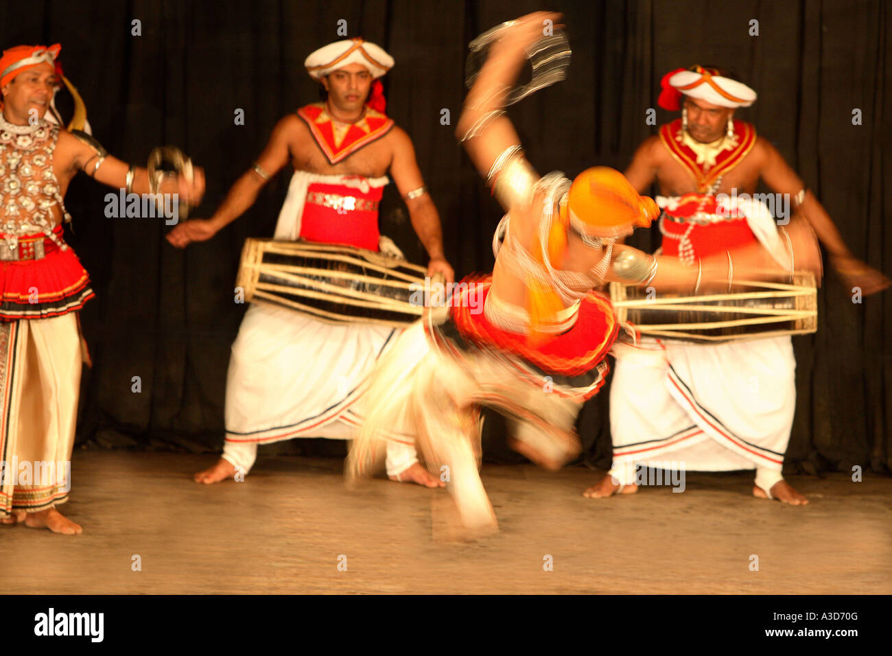 Portrait of world famous Kandy dancers in action performing on stage in ...